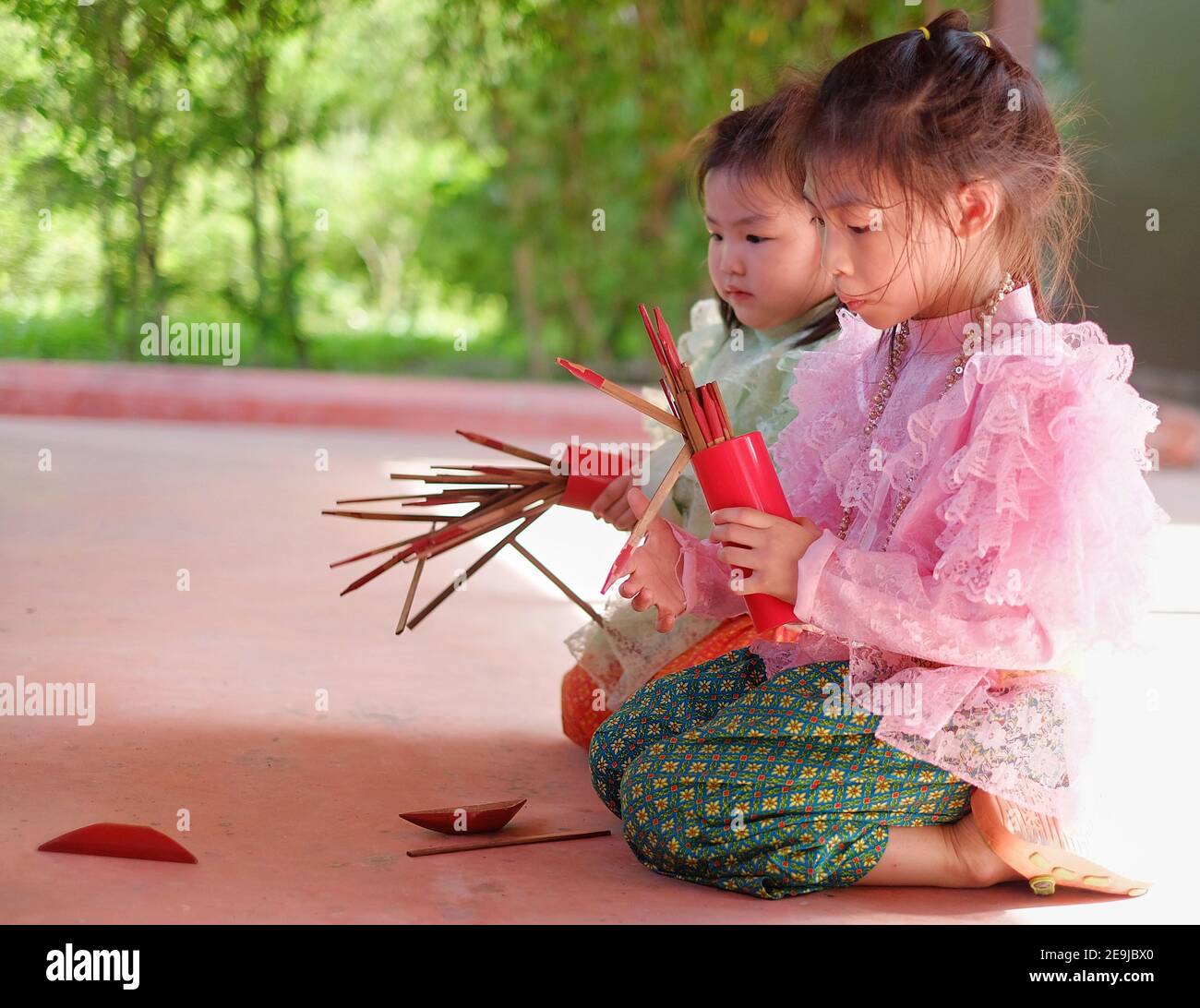 Cute Young Asian Girls In Traditional Thai Costumes Are Shaking Chi Chi