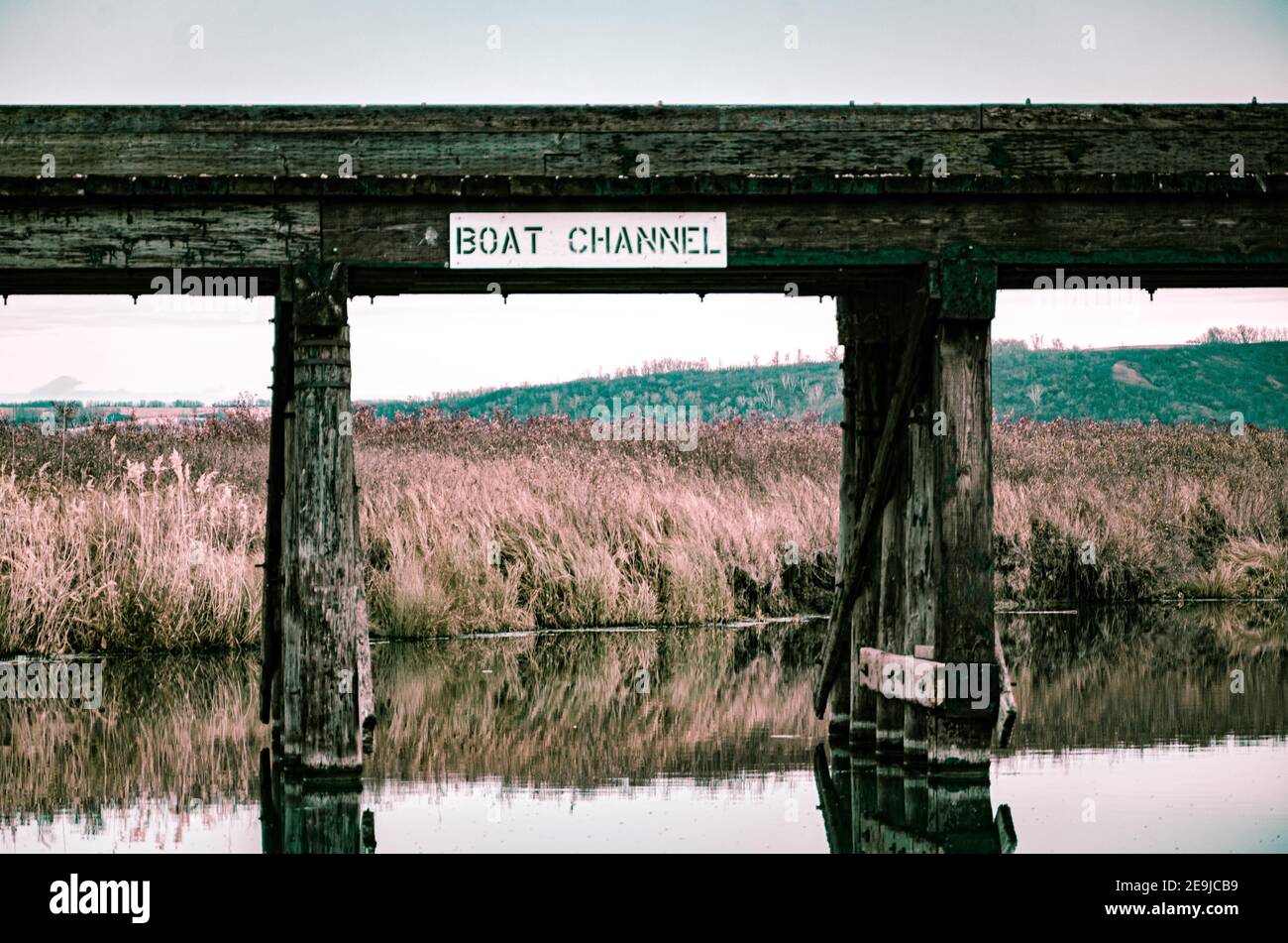 Sign with " BOAT CHANNEL" written on it on an old and weathered wooden ...