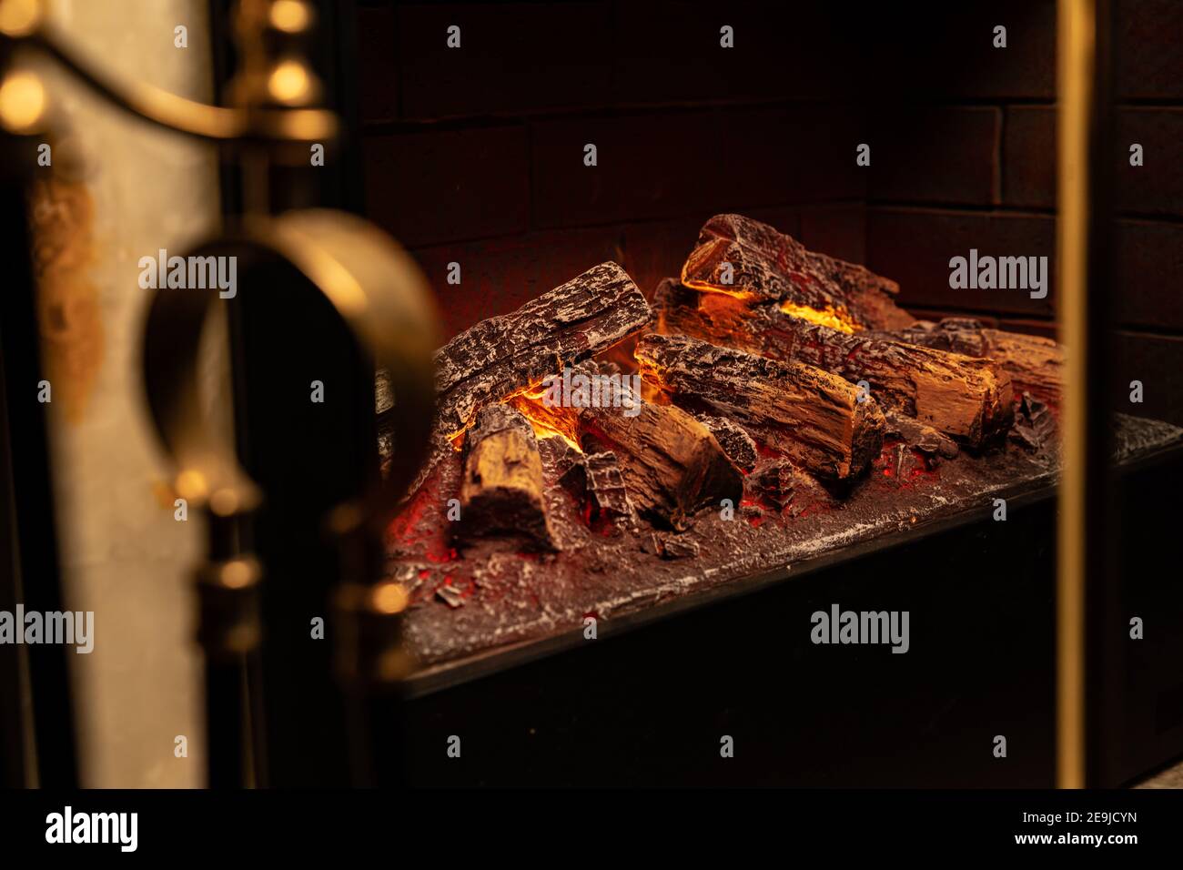 Close up of a fireplace with burning wood logs inside Stock Photo - Alamy