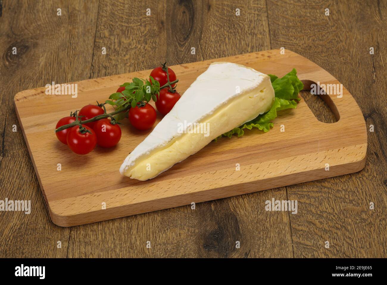 Brie cheese triangle served salad leaves Stock Photo - Alamy