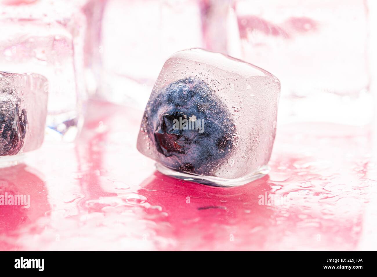 Berry ice cubes for decorating beverages close up Stock Photo - Alamy