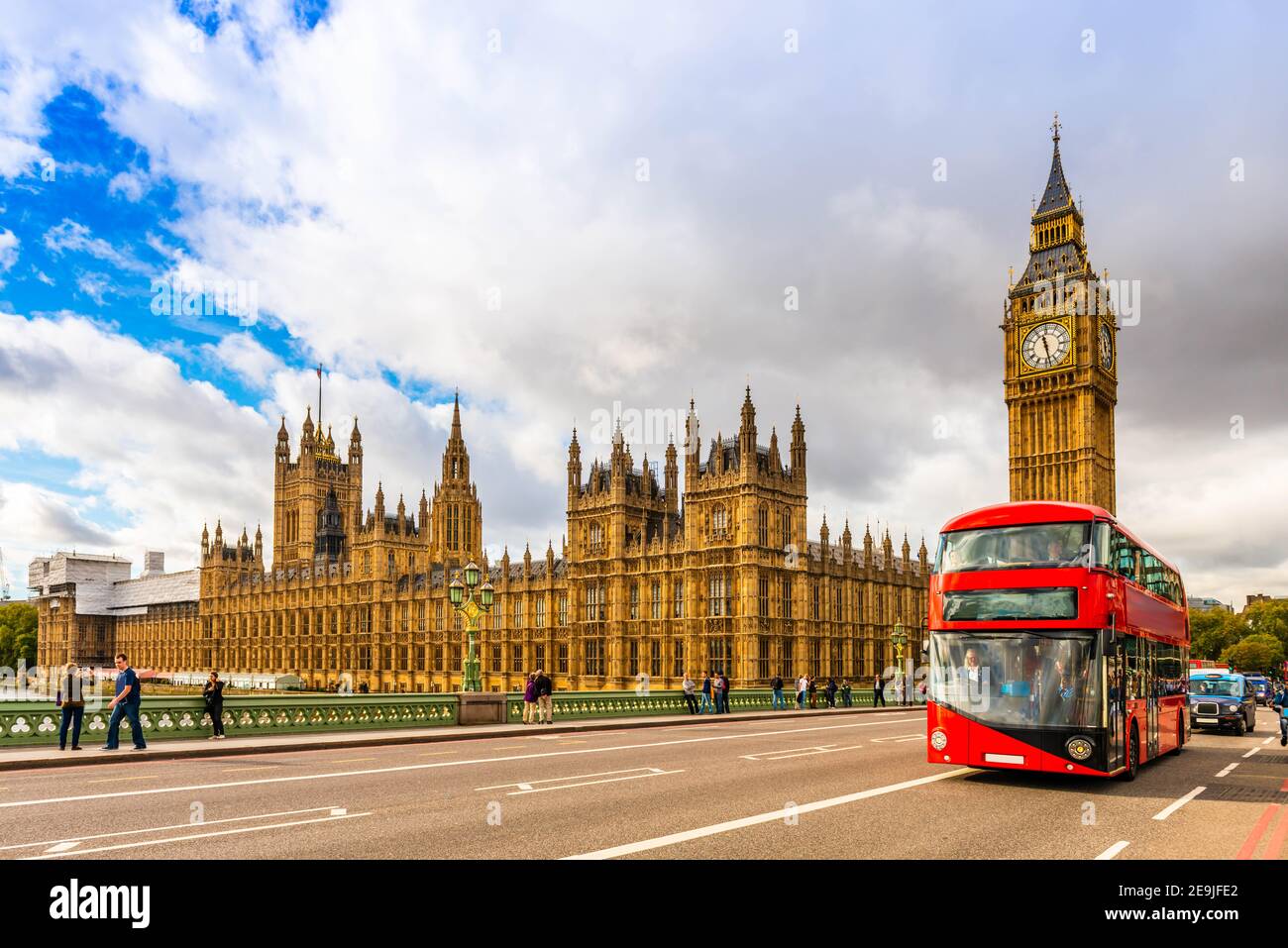 The Houses of Parliament and an iconic red imperial bus, on Westminster ...