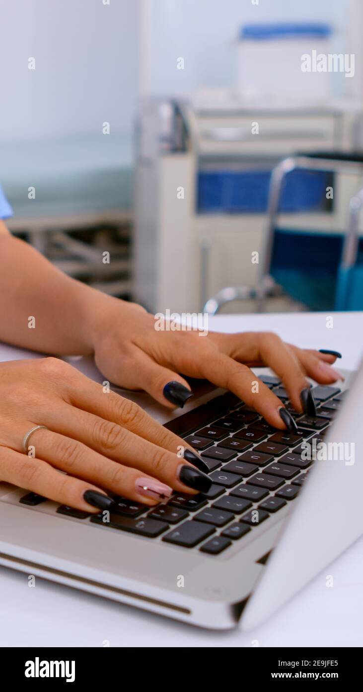 Close up of medical woman nurse writing results of patient radiography ...