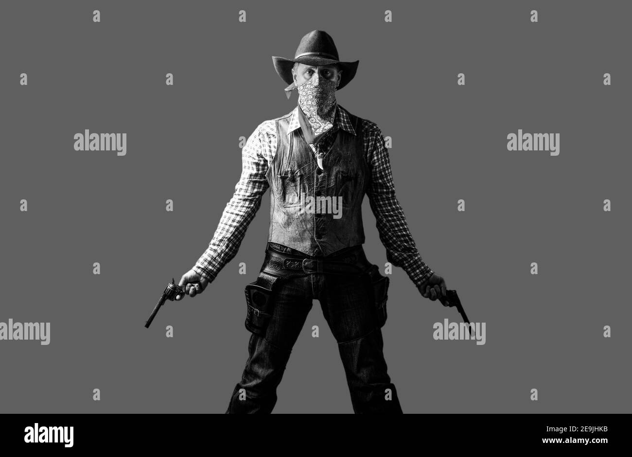 Man wearing cowboy hat, gun. West, guns. American bandit in mask ...