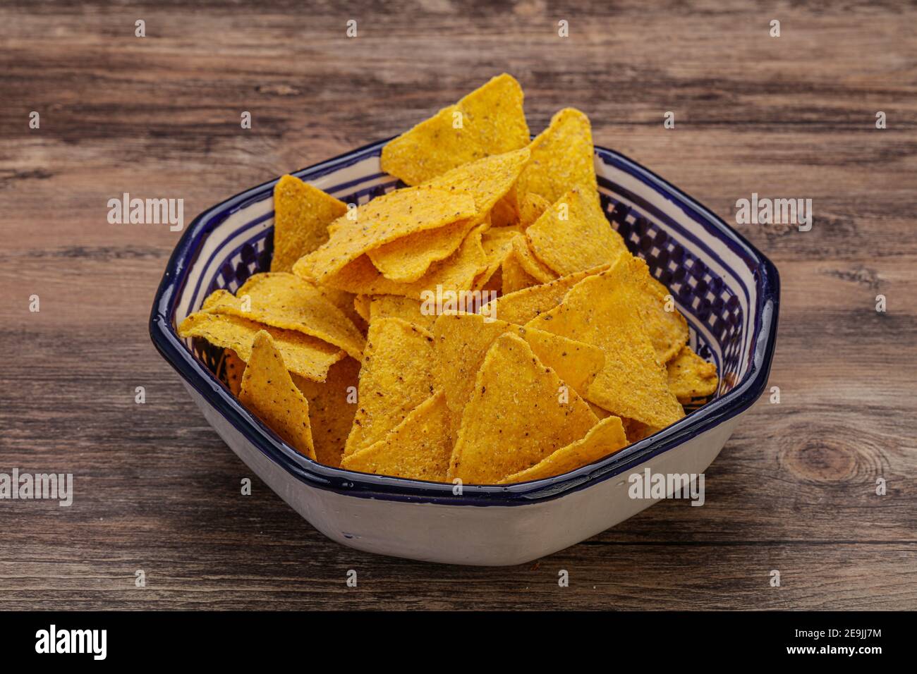 Mexican crunchy corn nachos triangle heap Stock Photo - Alamy