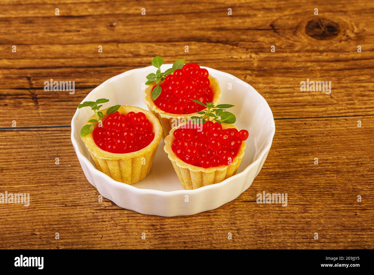 Apetizer - tartlet with red caviar snack Stock Photo - Alamy