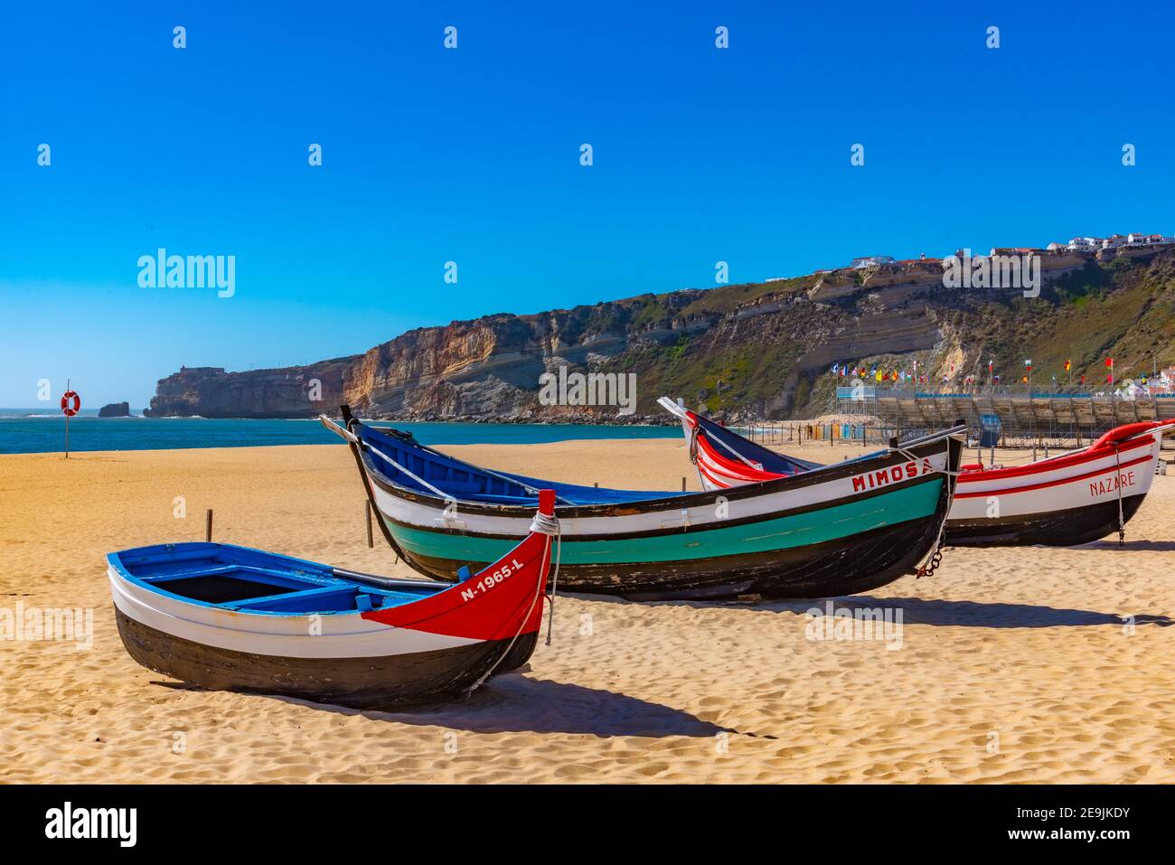 Wooden boats on beach at nazare, Portugal Stock Photo - Alamy