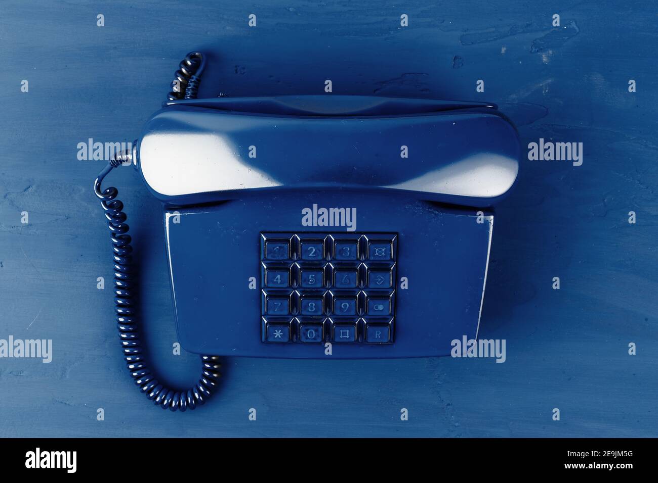 Retro telephone of blue color on classic blue background Stock Photo ...