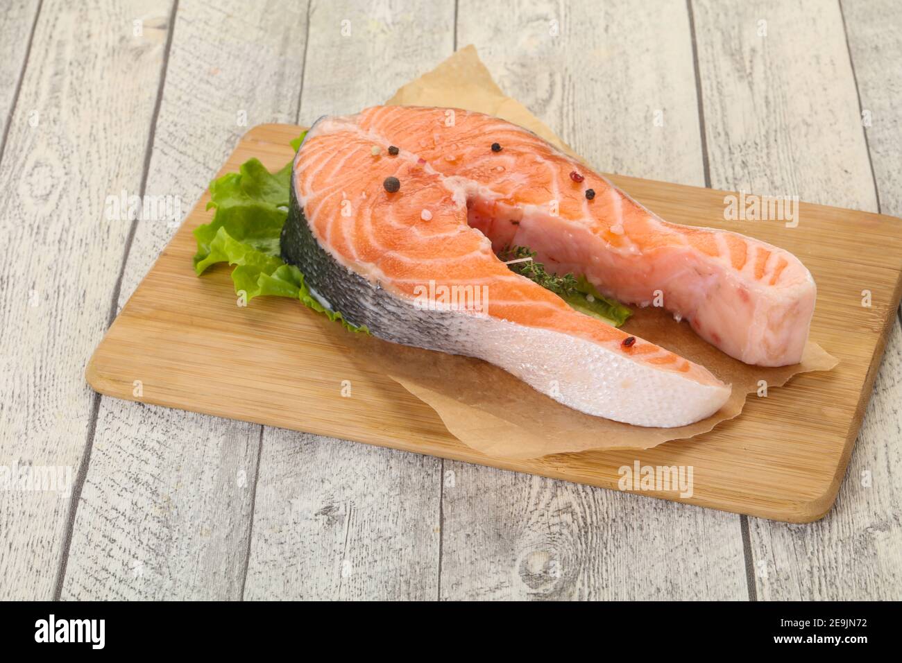 Raw salmon steak with salt and pepper - ready for grill Stock Photo - Alamy