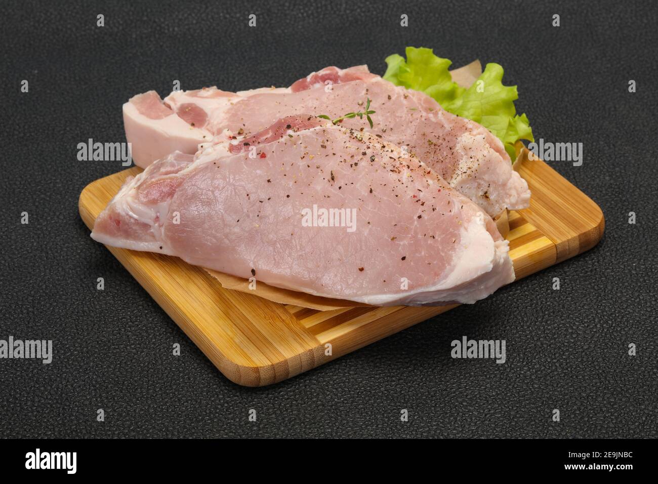 Raw pork meat steak ready for grill Stock Photo - Alamy