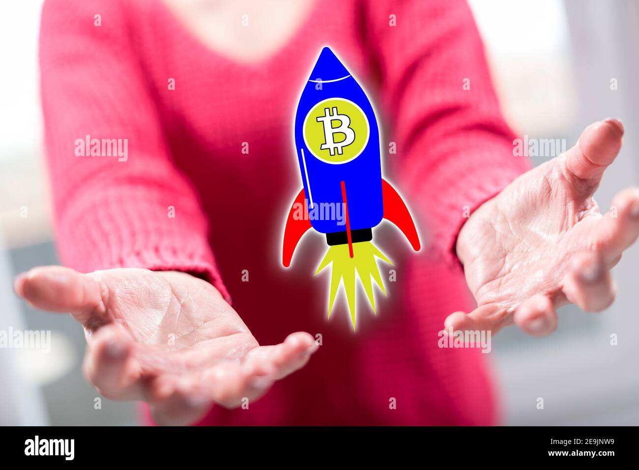 Bitcoin rise concept above the hands of a woman in background Stock ...