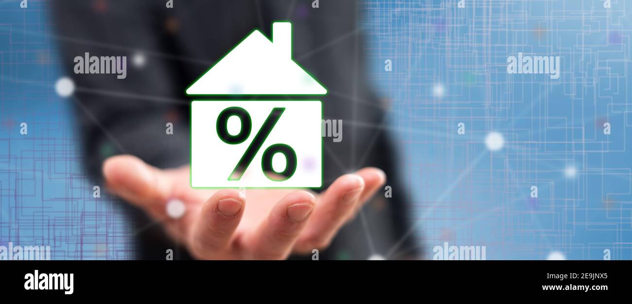 Interest rates concept above the hand of a man in background Stock ...