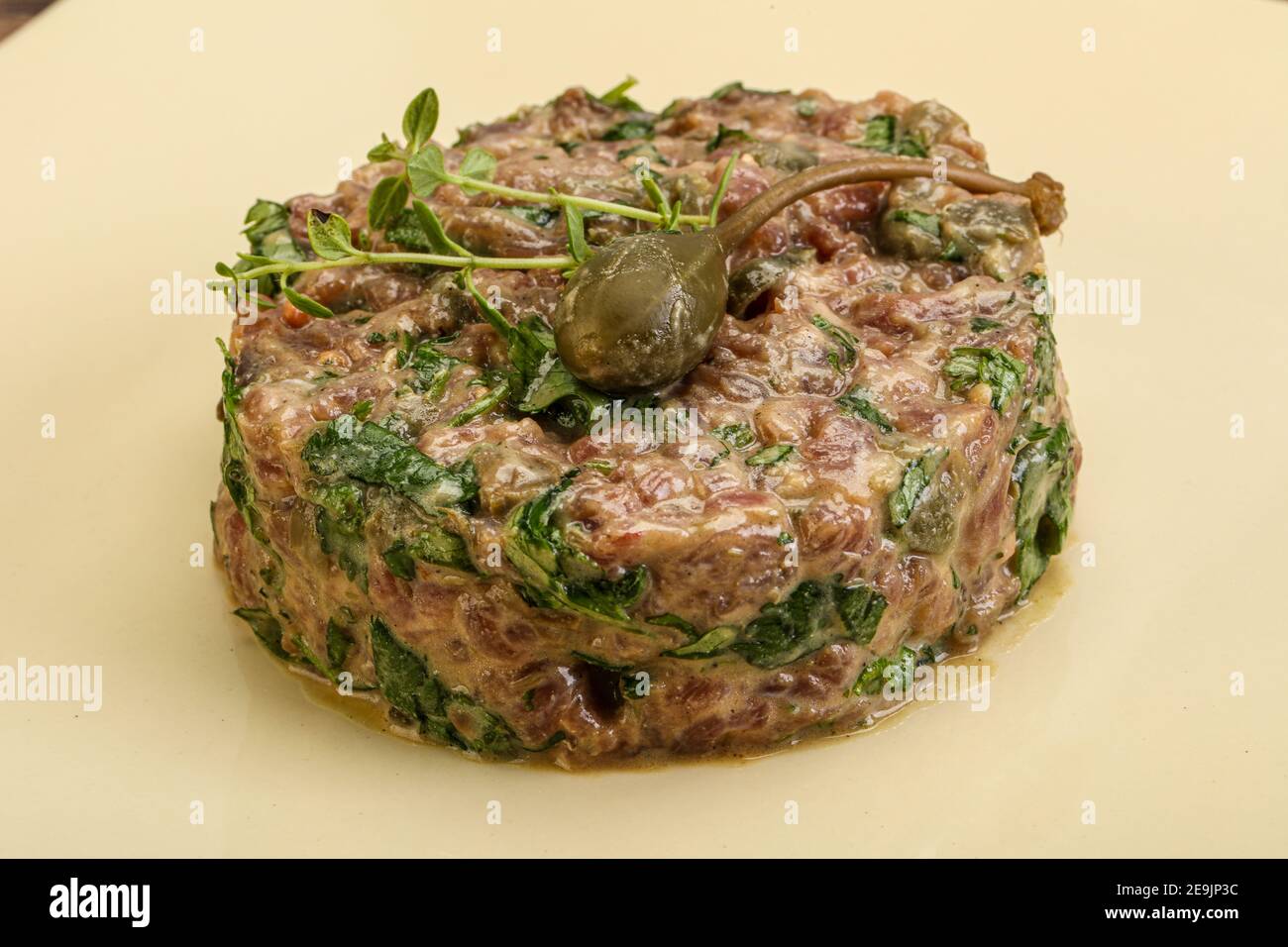 Raw beef tartar snack with capers Stock Photo - Alamy
