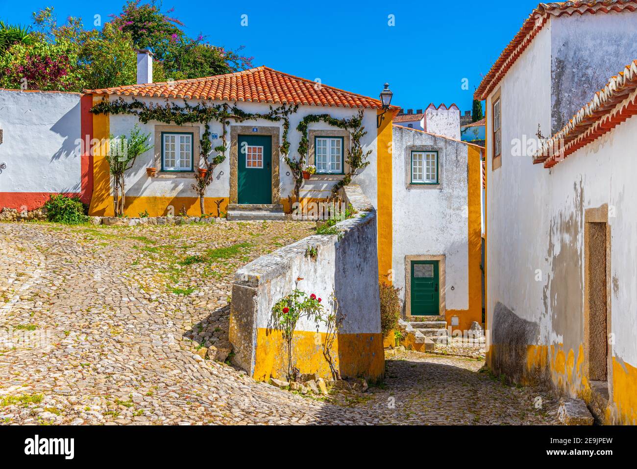 a narrow street inside of the obidos castle in Portugal Stock Photo - Alamy