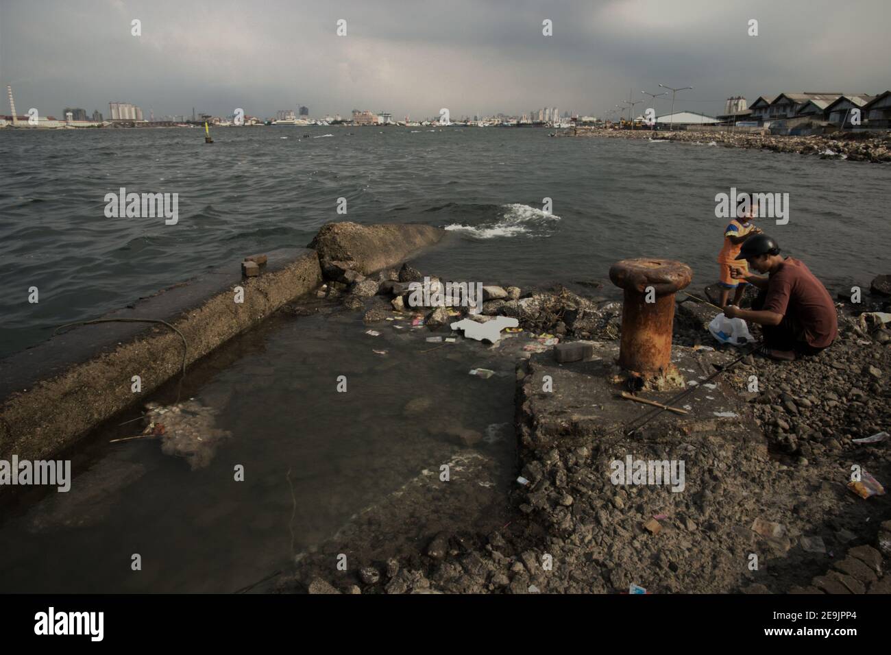 Man and child getting ready to have a recreation by fishing from an ...