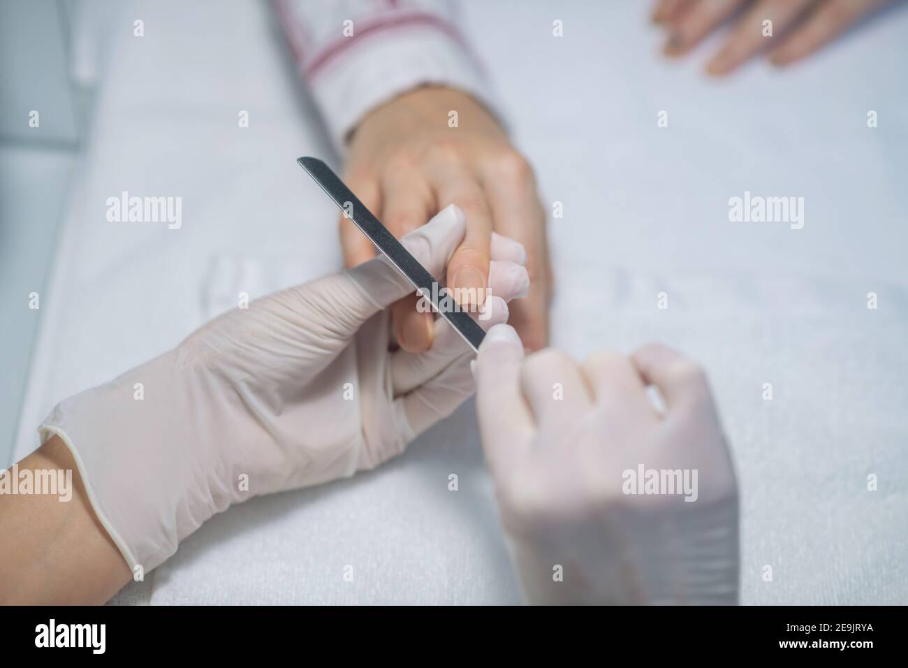 Female hands filing nails hi-res stock photography and images - Alamy