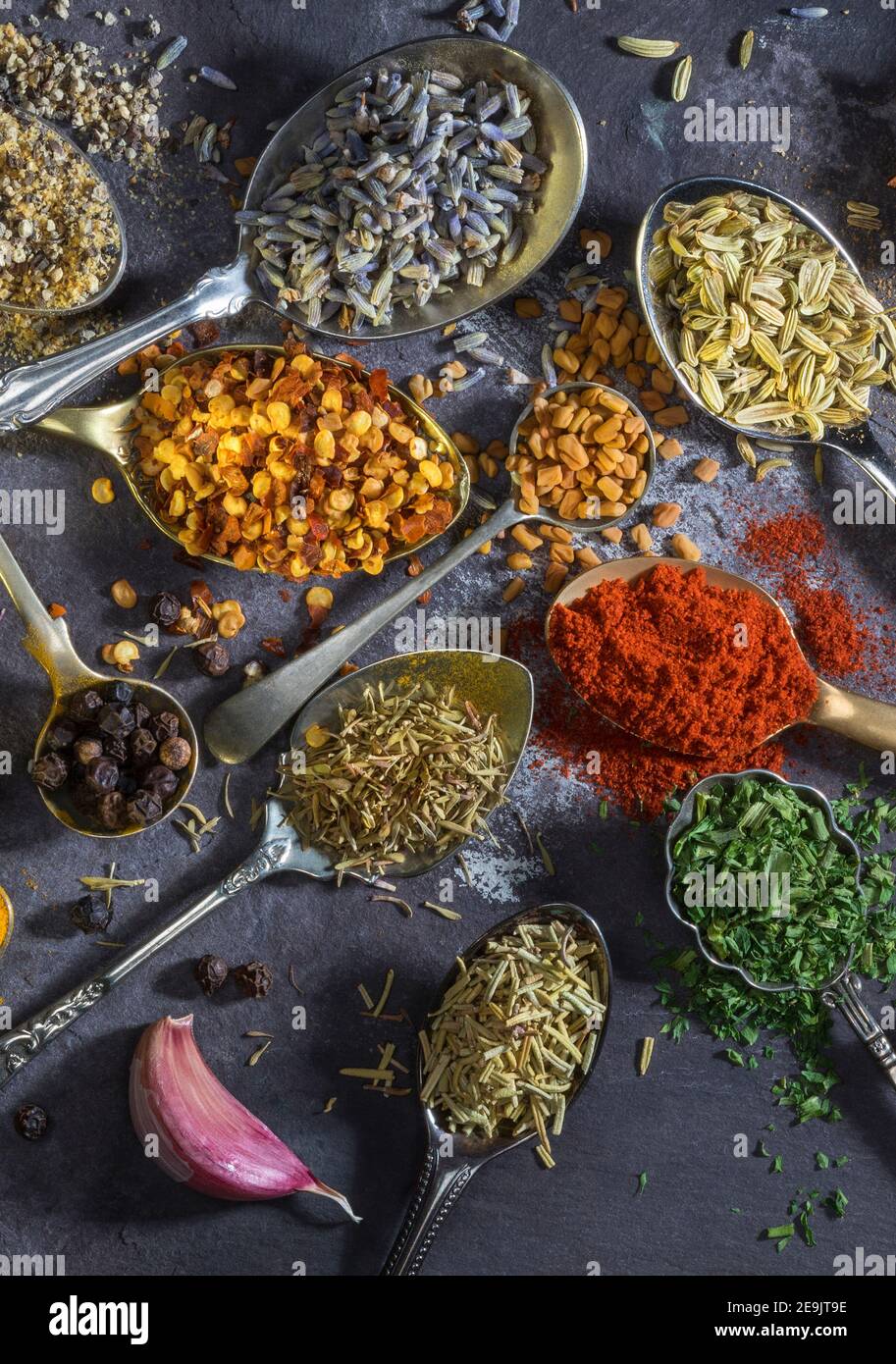Spices on spoons - a selection of spices used to add flavor to cooking ...