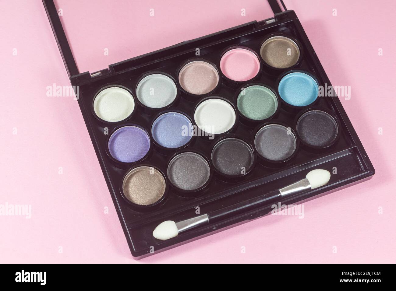 Open eye shadows box on pink background Stock Photo - Alamy