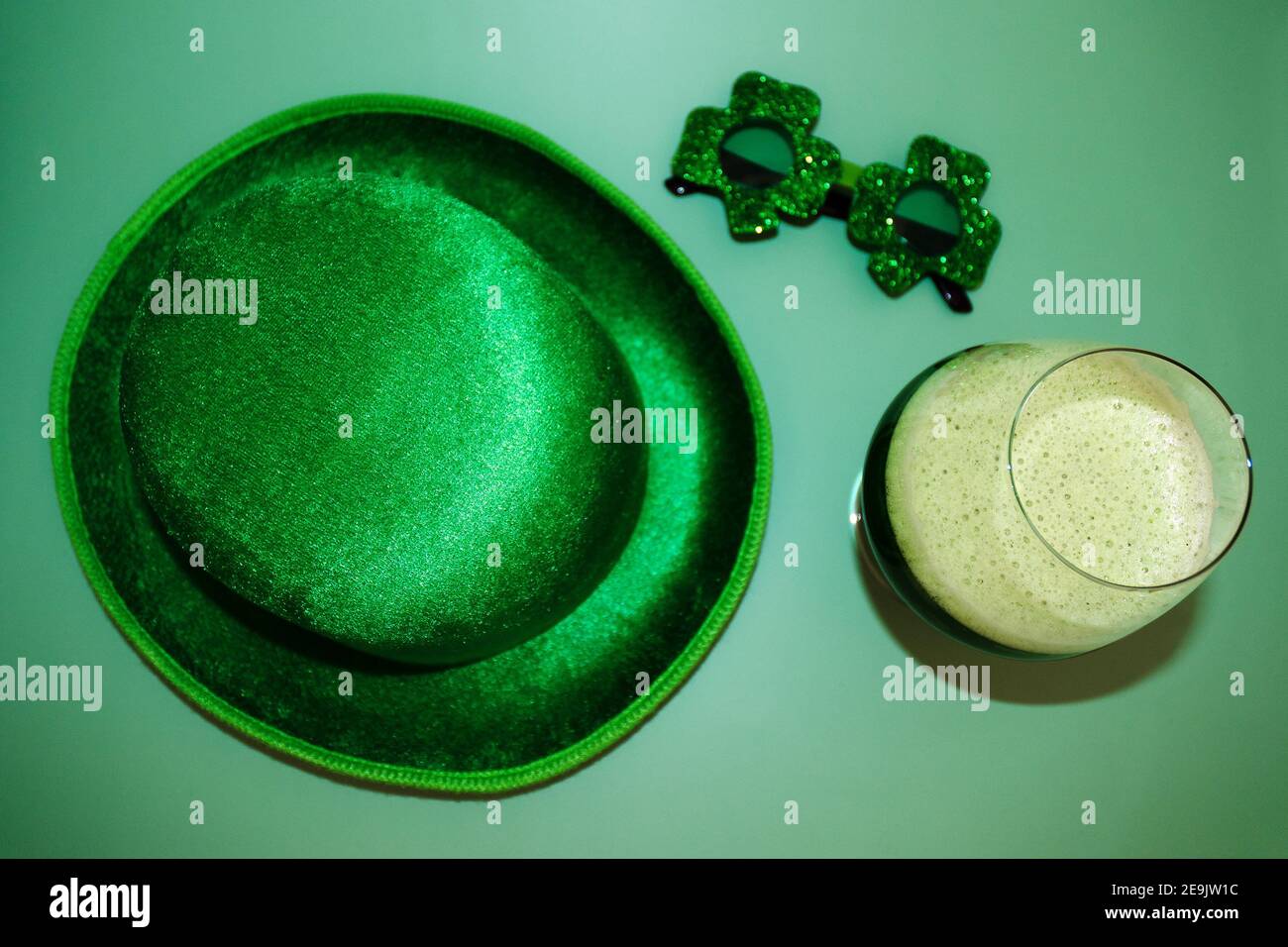 Happy St Patrick's Day concept. Glass of green beer. Party glasses and ...