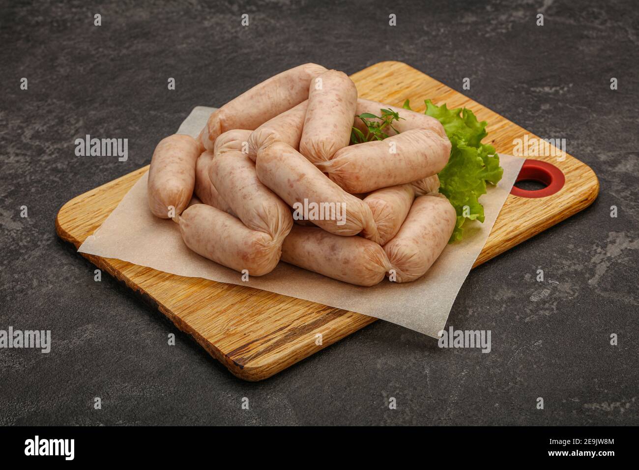 Raw natural chicken baby sausages for roast Stock Photo - Alamy