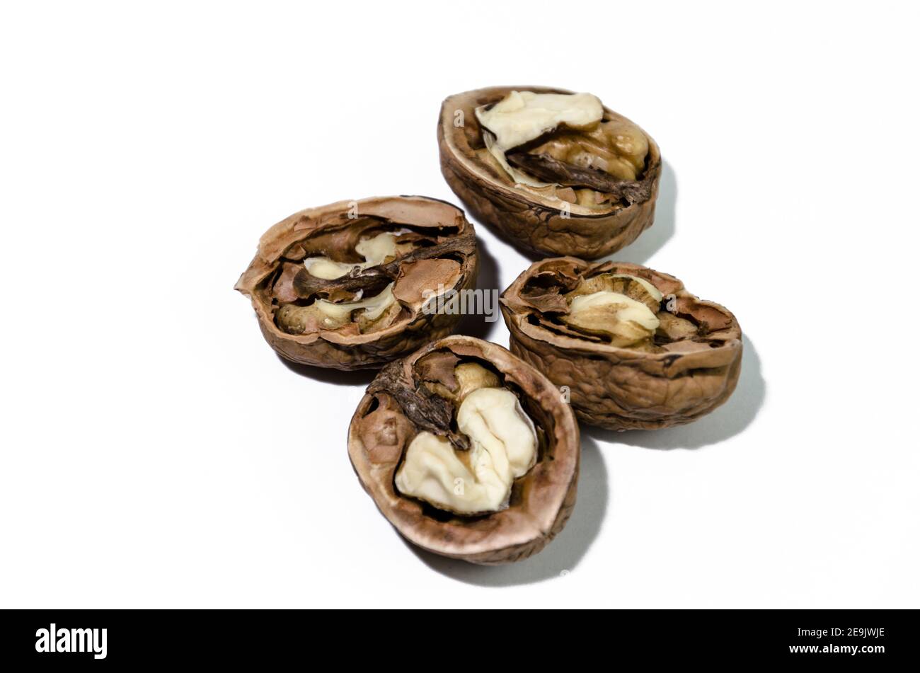 Open walnuts on white background, clipping path Stock Photo - Alamy