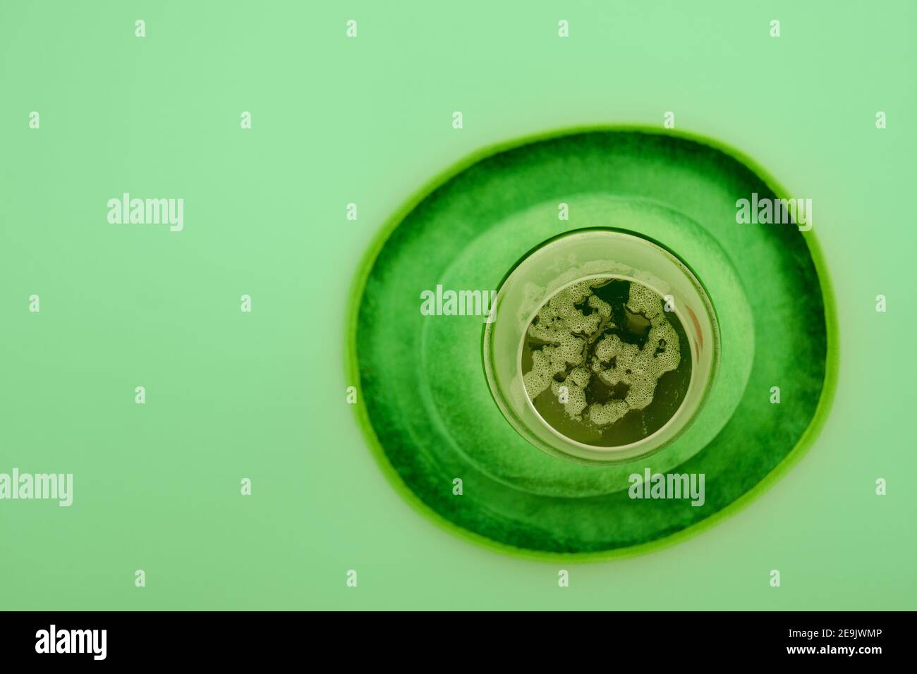 Happy St Patrick's Day concept. Glass of green beer. Party glasses and ...