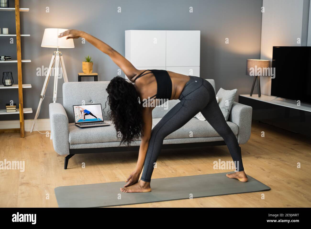 Online Laptop Home Fitness Workout And Exercise Stock Photo - Alamy