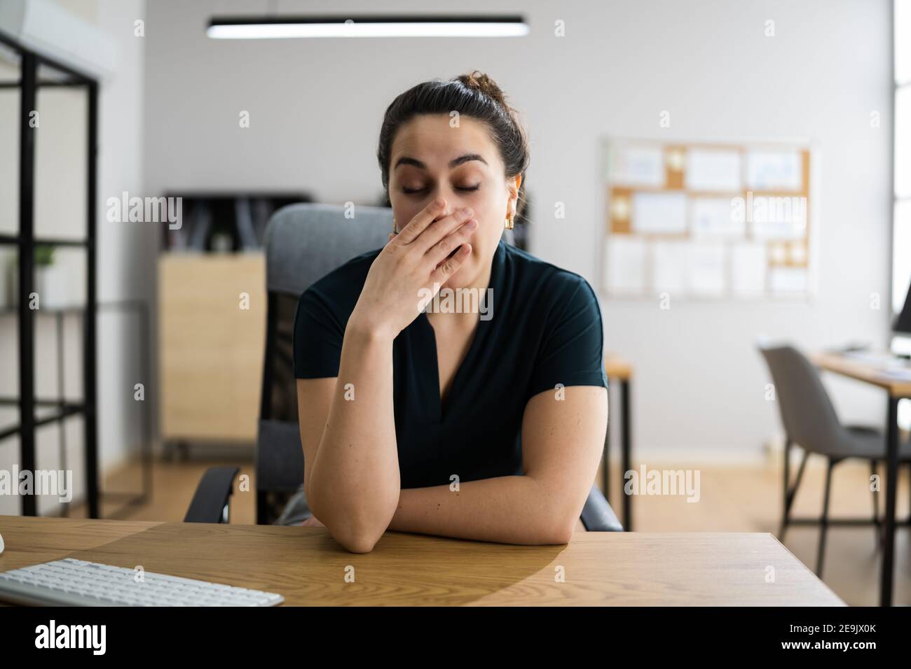 Tired Bored Woman In Office. Businesswoman Exhausted Stock Photo - Alamy