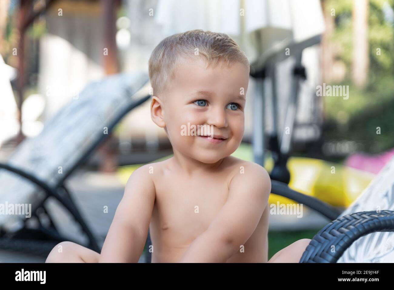 Kid sunbathing in the pool hi-res stock photography and images - Alamy