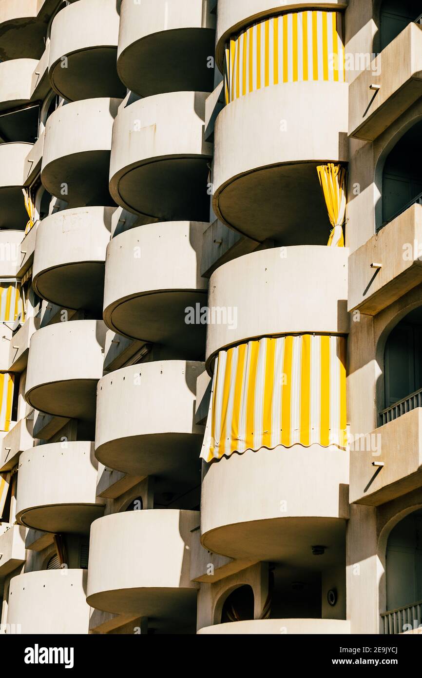 Vertical of contemporary beautiful high rise buildings with round ...