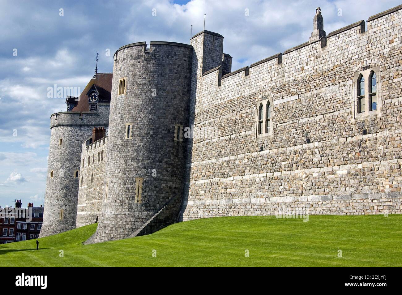 Imposing walls of Windsor Castle viewed from the town's High Street ...