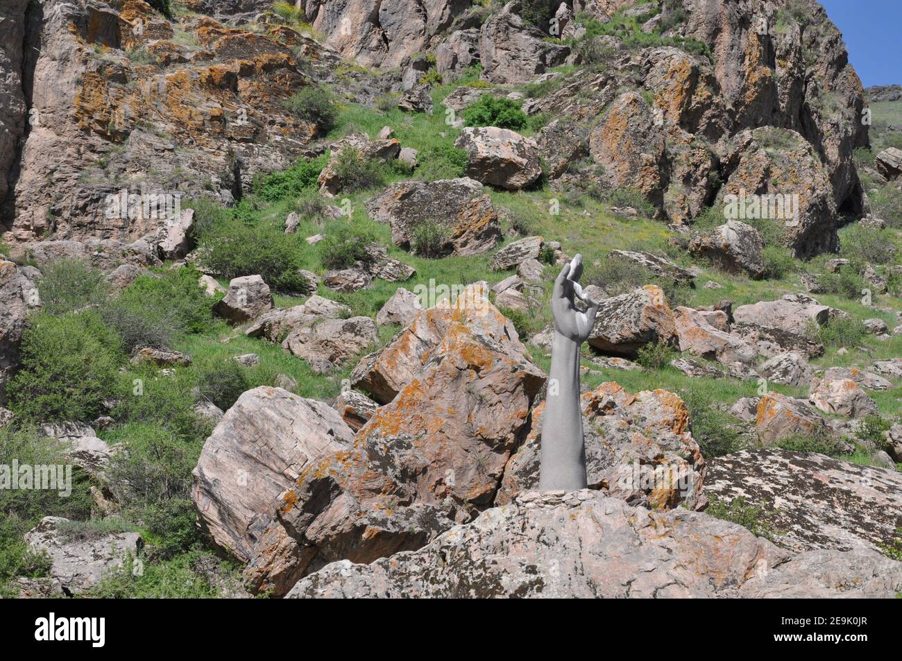 View of a hand statue on a rock in the mountain at Arm Stock Photo - Alamy