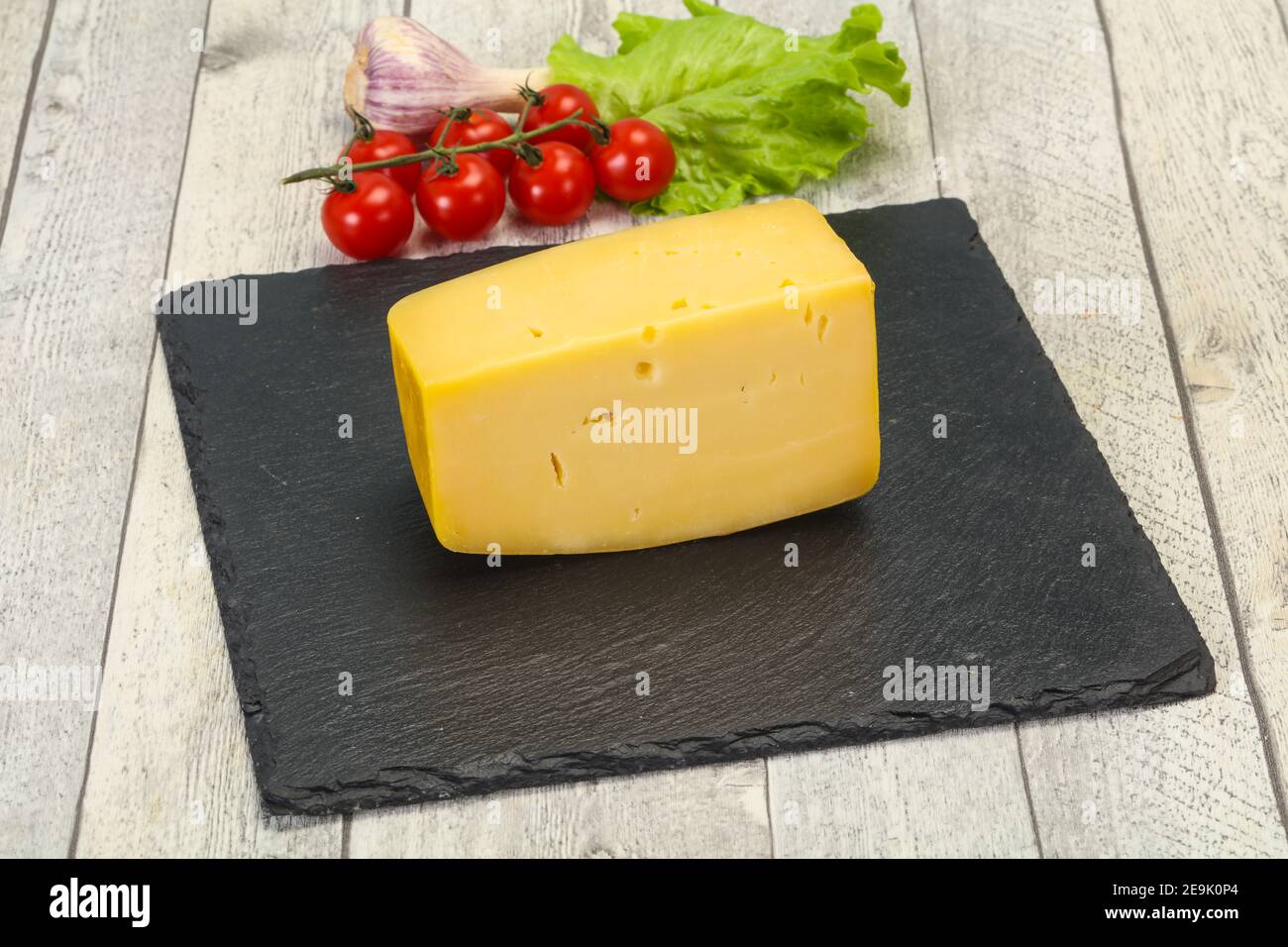 Swiss Hard yellow tasty cheese brick Stock Photo - Alamy