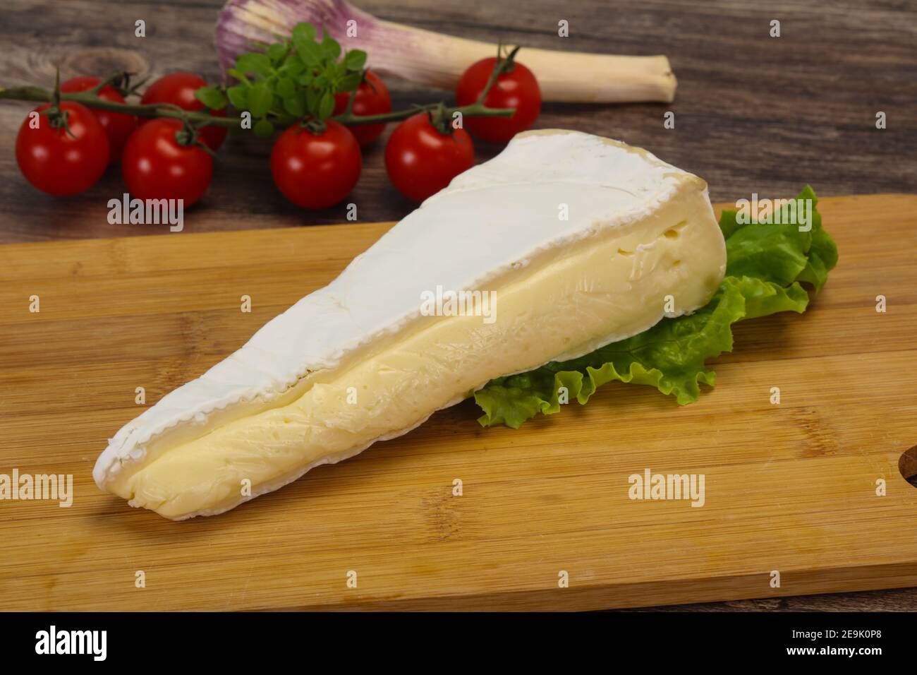 Brie cheese triangle served salad leaves Stock Photo - Alamy