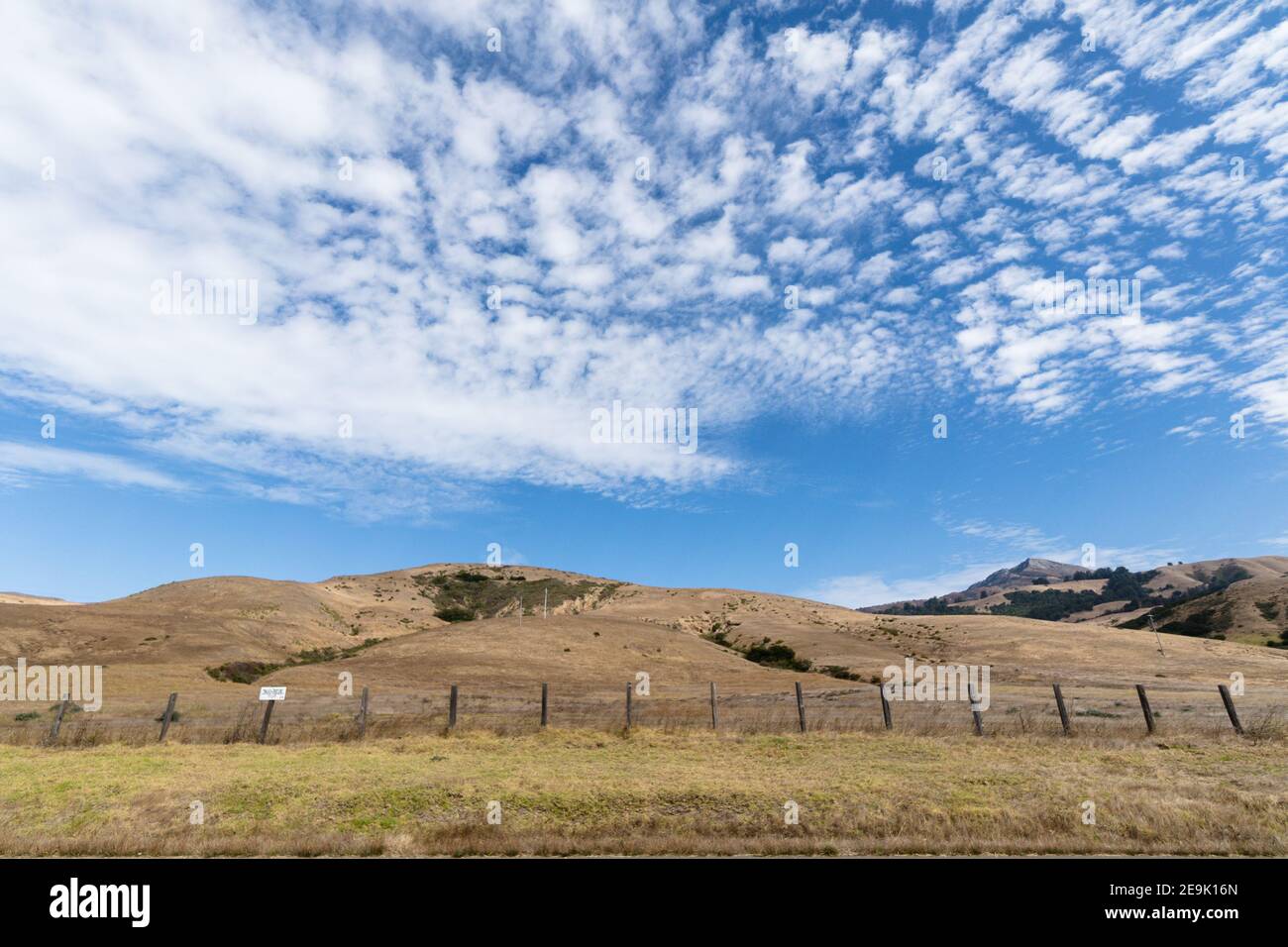 Landscape of a farm field with fence under a beautiful cloudy sk Stock ...