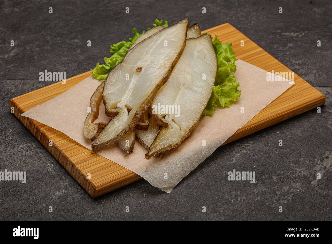 Delicous smoked halibut fish slices snack Stock Photo - Alamy