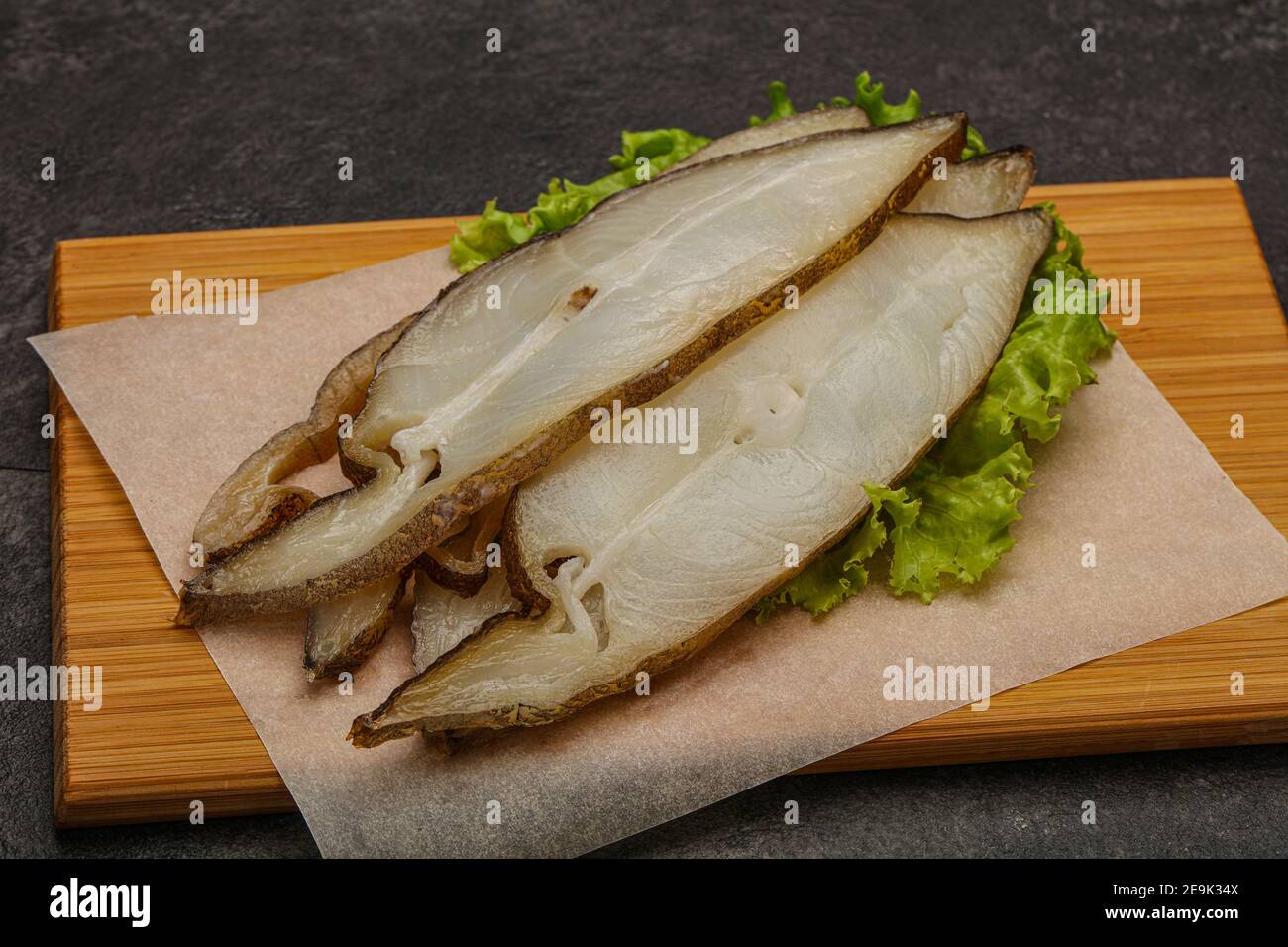 Delicous smoked halibut fish slices snack Stock Photo - Alamy