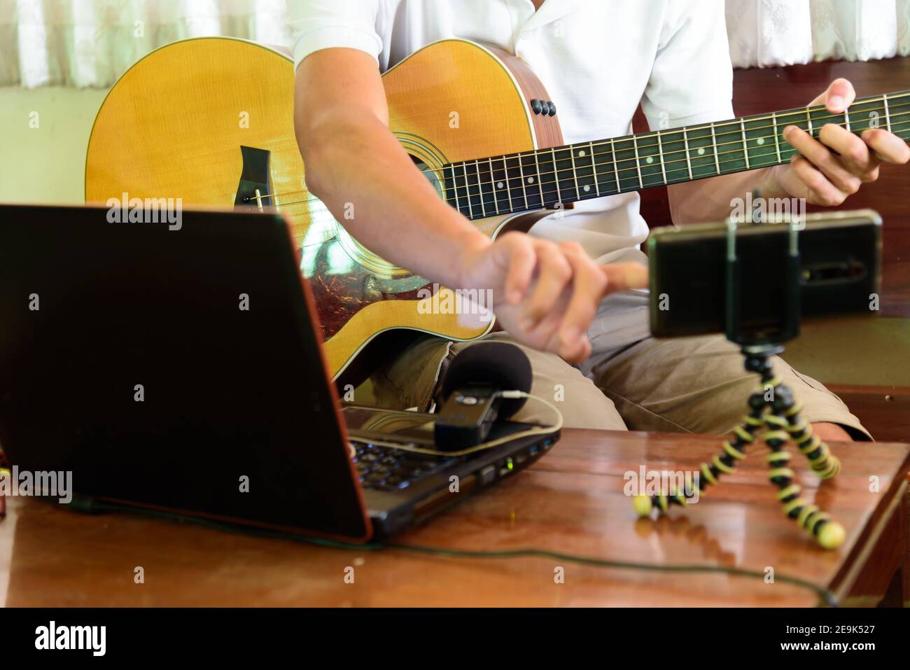 musician live streaming playing guitar show from home Stock Photo - Alamy