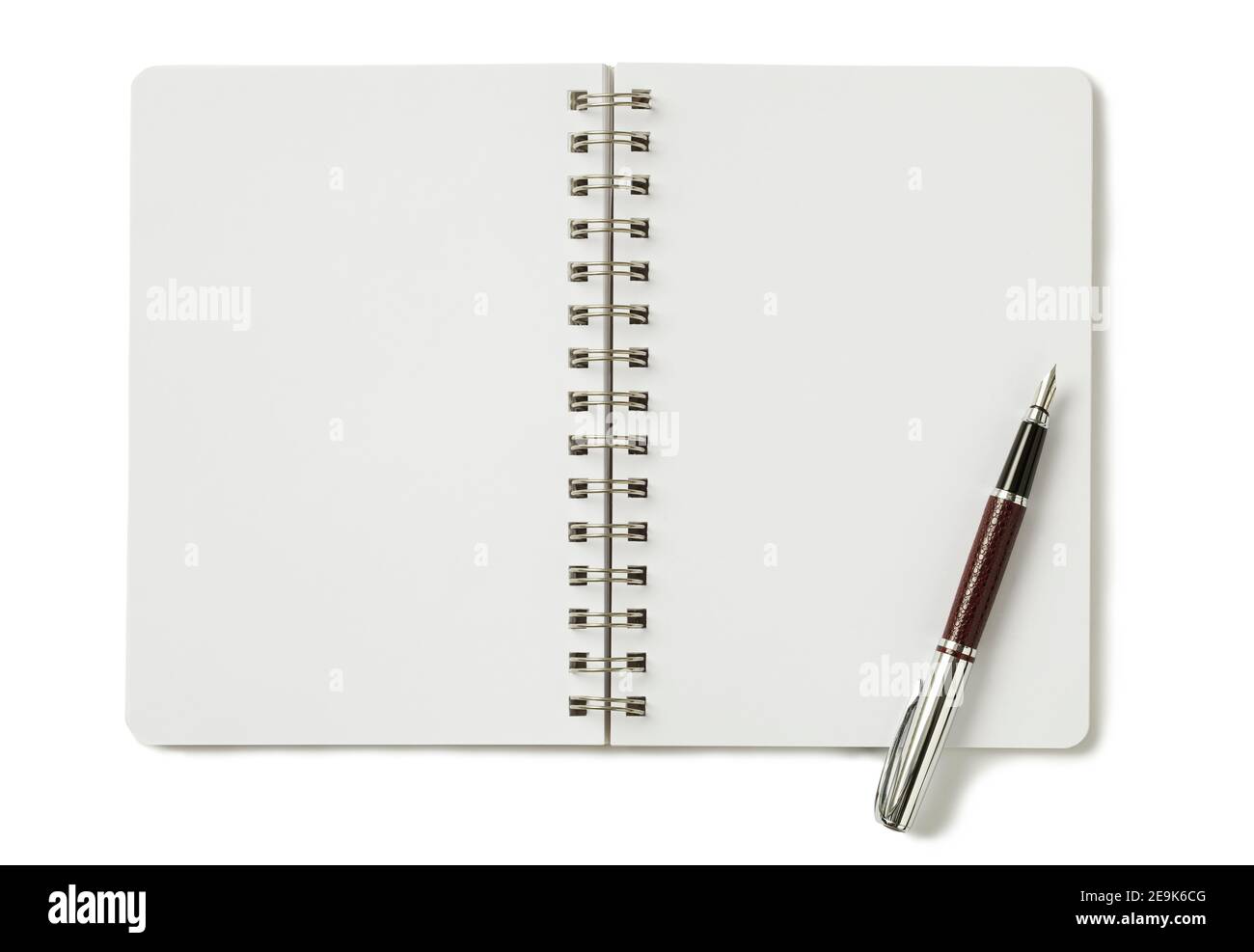 Open spiral notepad with a pen at the left ready to write Stock Photo ...