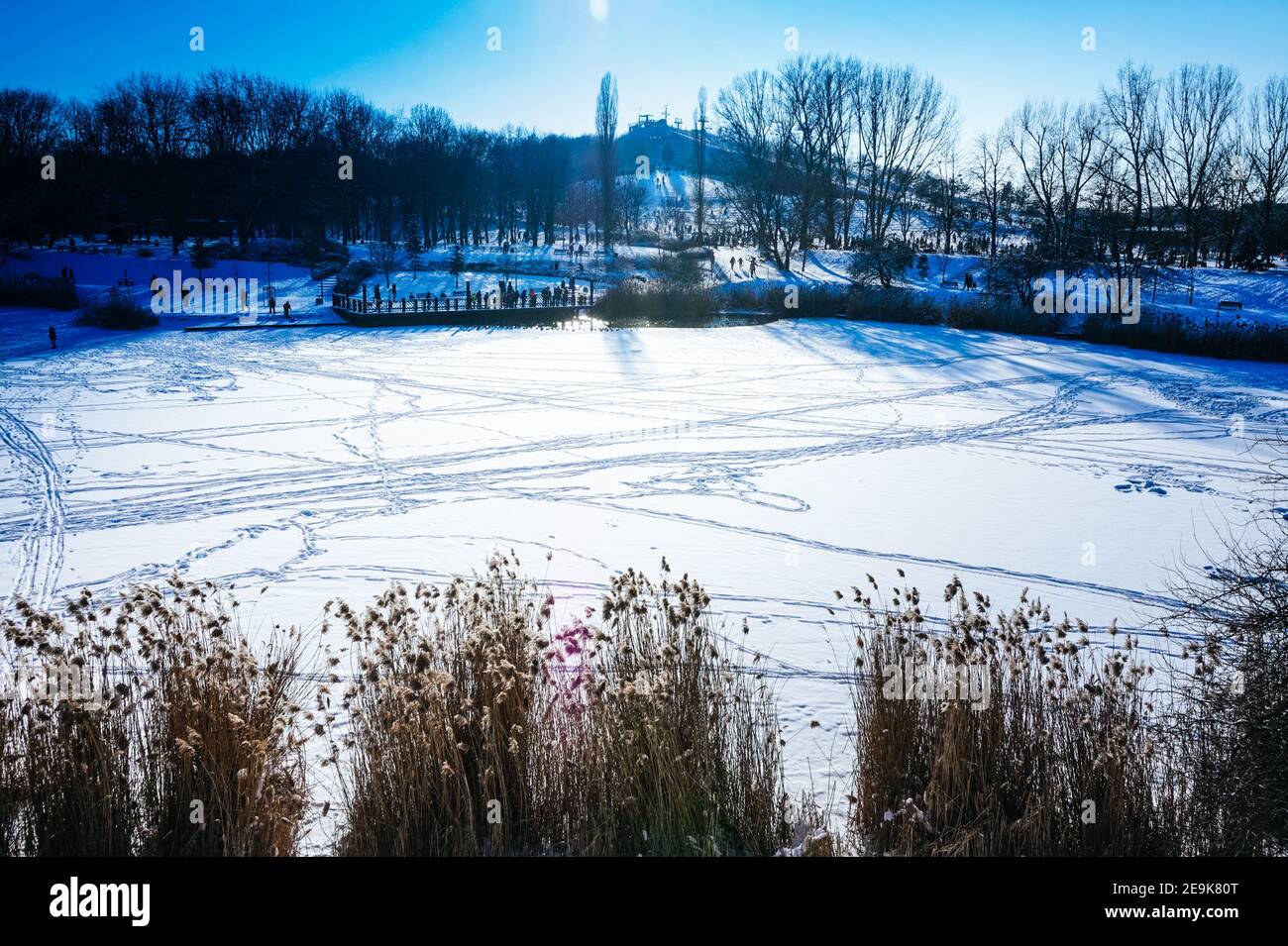 Frozen lake covered with snow in winter Stock Photo - Alamy