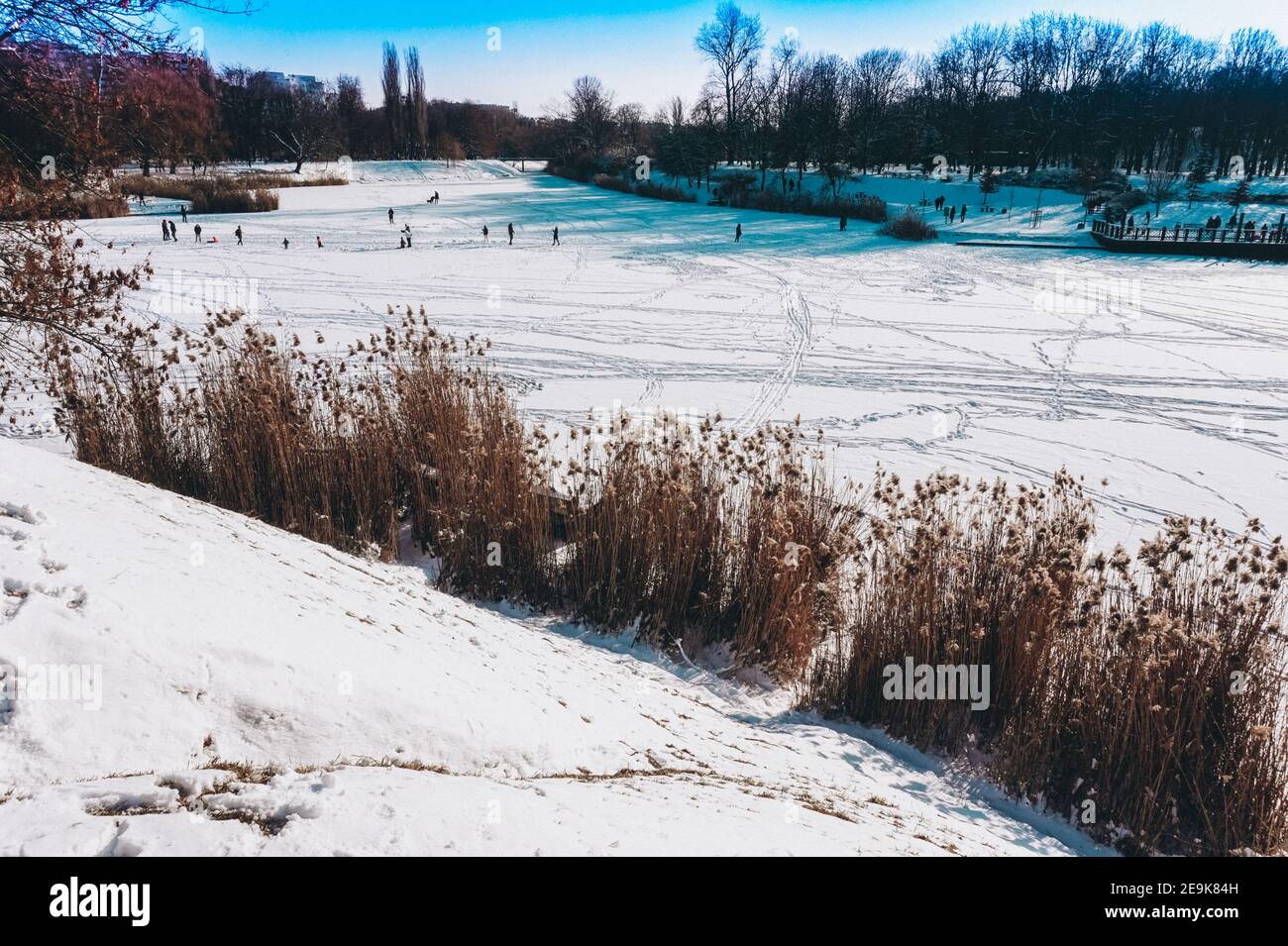 Frozen lake covered with snow in winter Stock Photo - Alamy