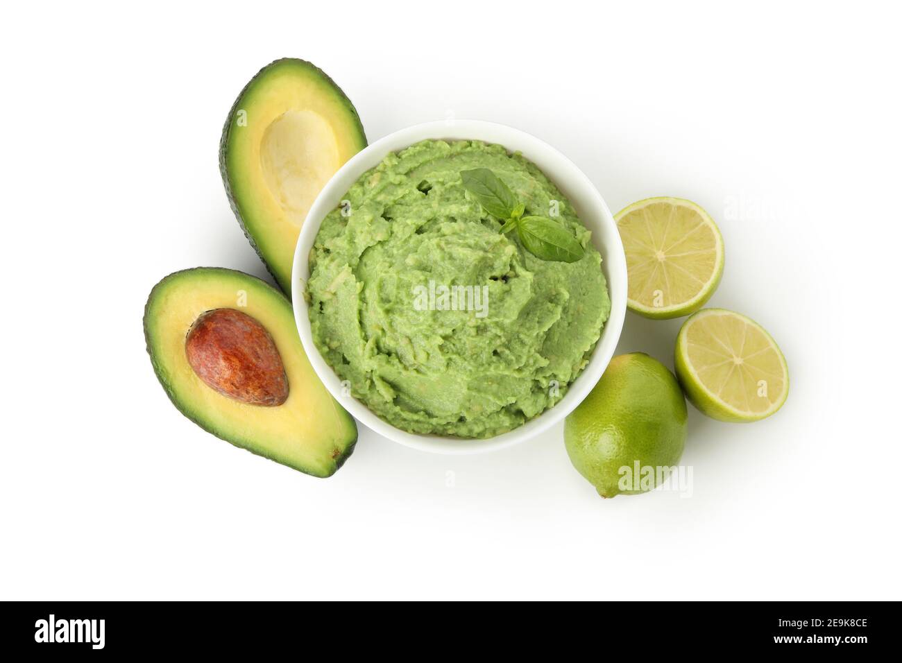 Bowl of guacamole, avocado and lime isolated on white background Stock ...