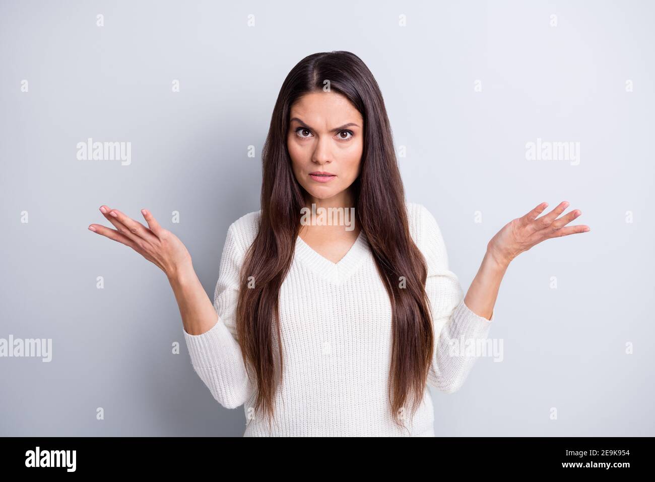 Portrait of attractive discontent puzzled brown-haired girl pretense ...