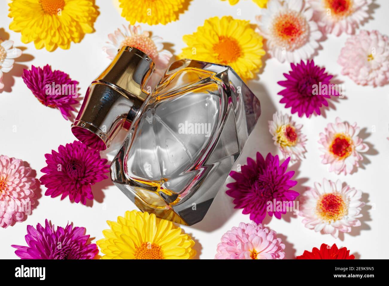 Perfume bottle for women in flower buds Stock Photo - Alamy