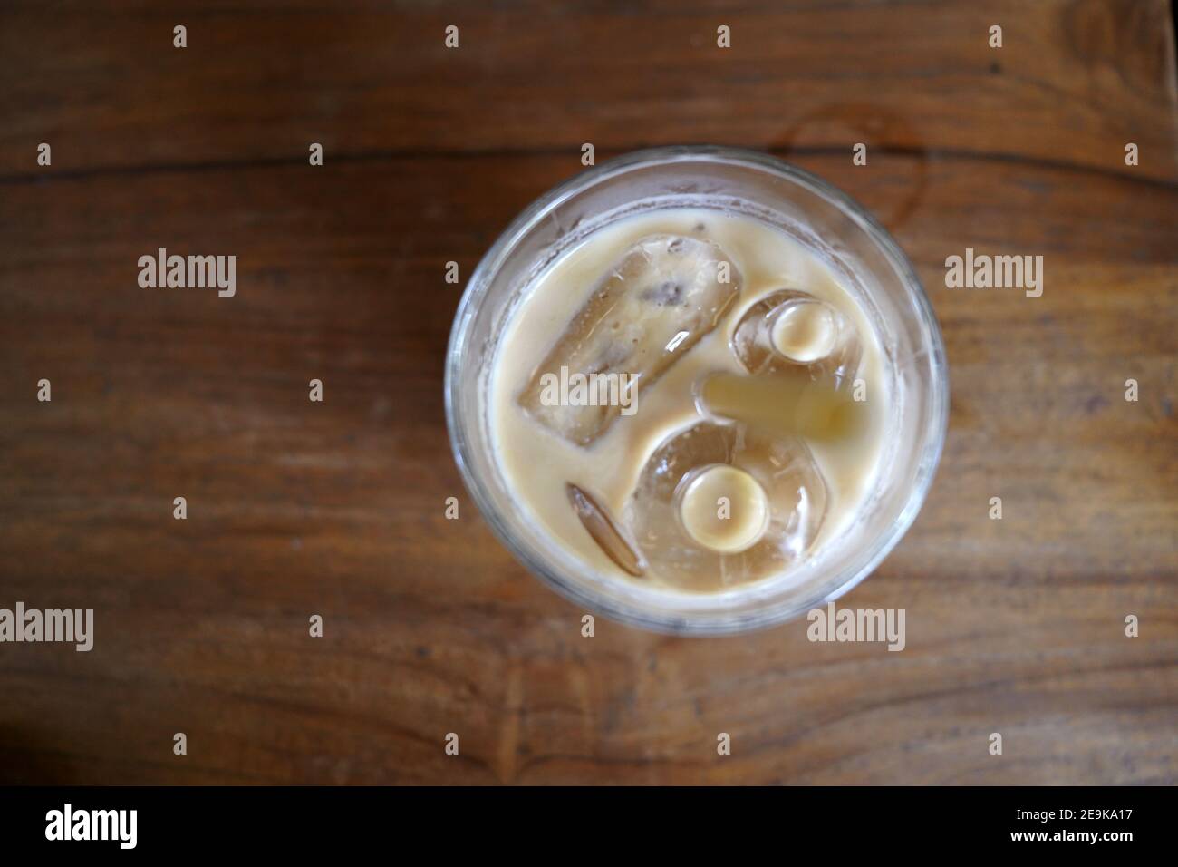 High angle shot of iced coffee on the wooden table Stock Photo - Alamy