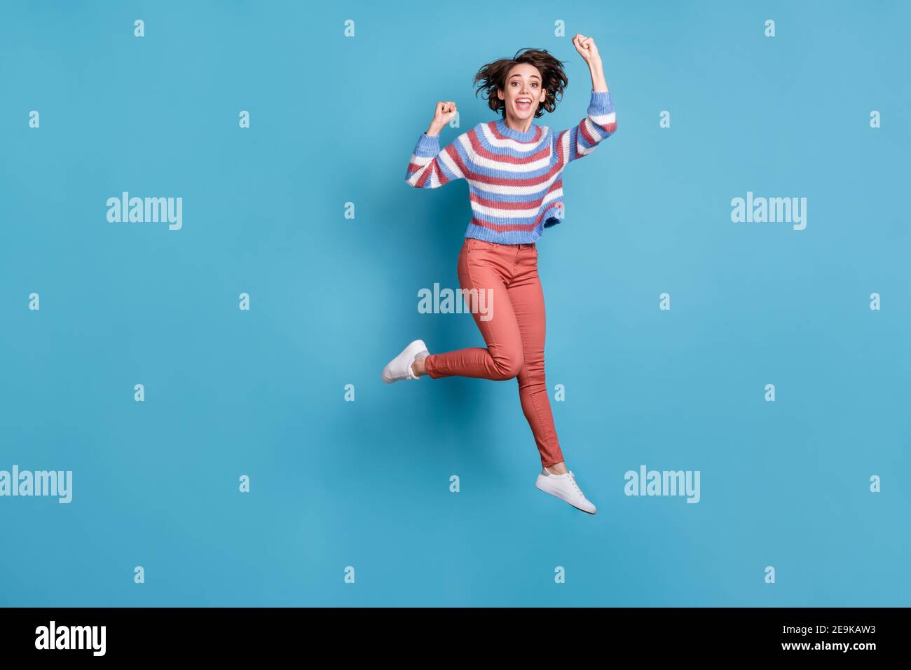 Full length body size photo of jumping cheerfully young girl gesturing ...