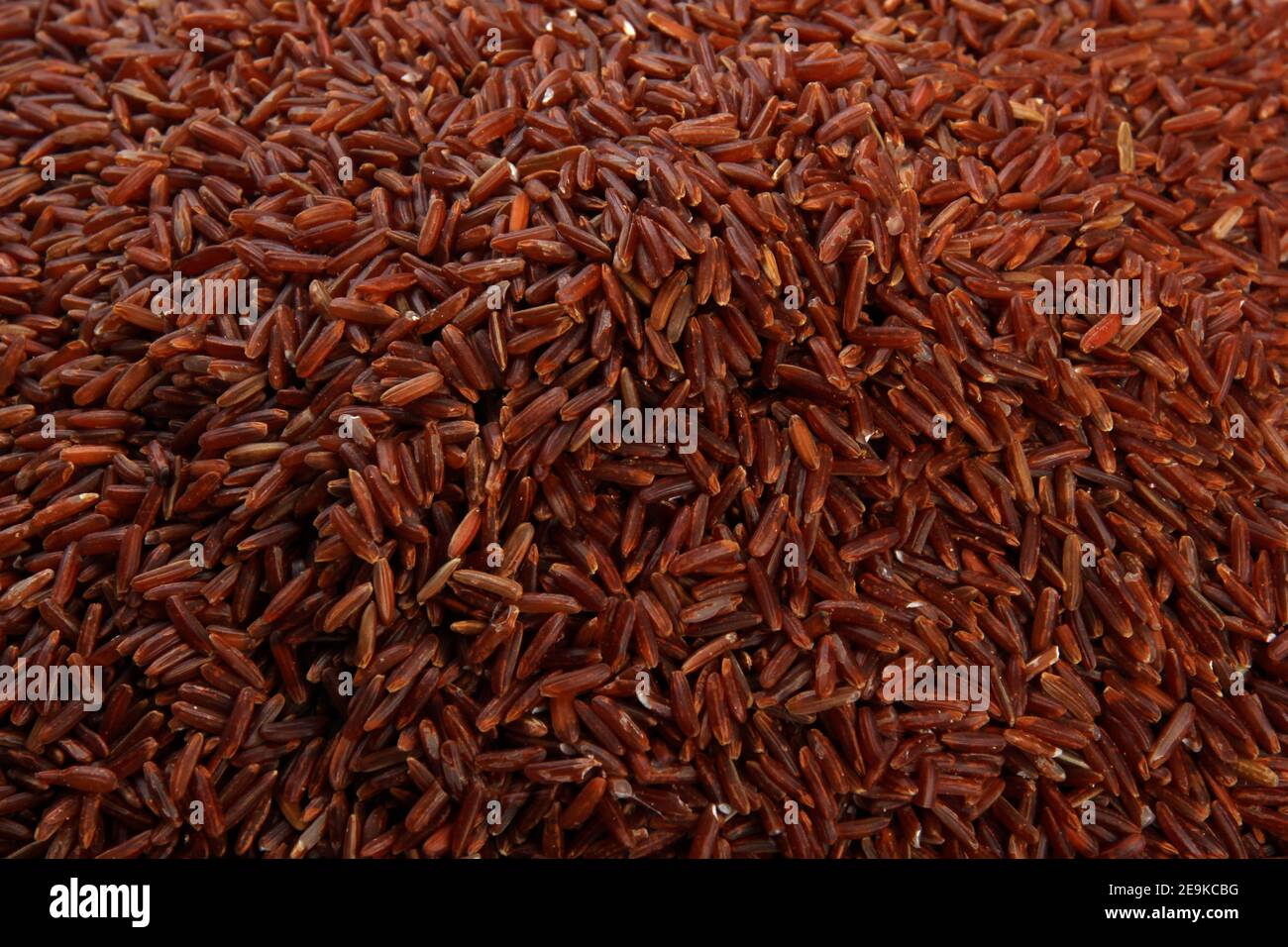 raw red rice background. uncooked brown wild rice, top view Stock Photo ...