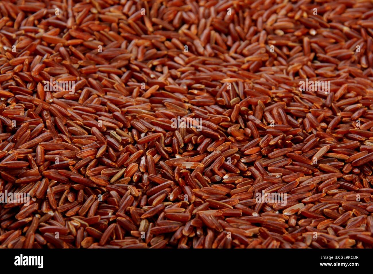 raw red rice background. uncooked brown wild rice, top view Stock Photo ...