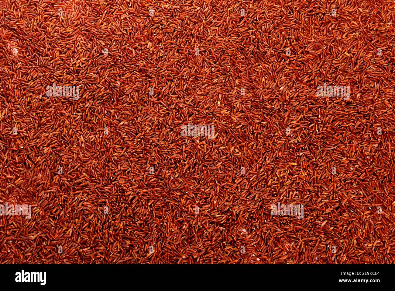raw red rice background. uncooked brown wild rice, top view Stock Photo ...