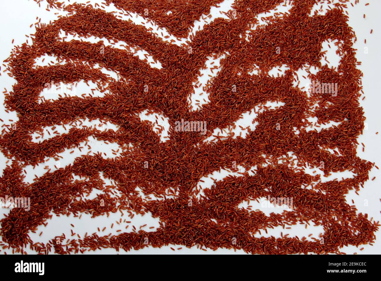 raw red rice background. uncooked brown wild rice, top view Stock Photo ...